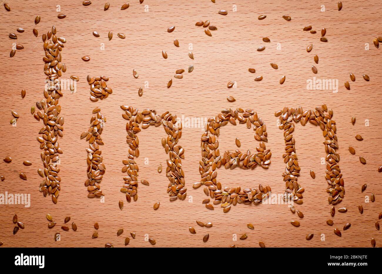 flax seeds on a wooden board Stock Photo - Alamy