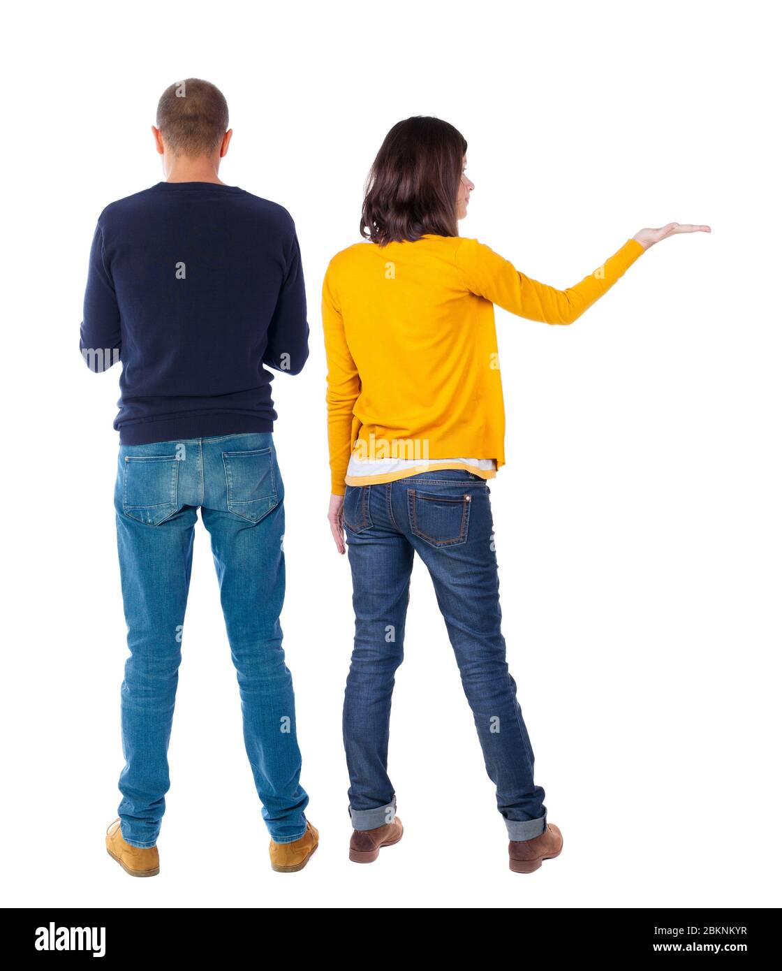 Back view of couple in sweater pointing. Rear view people collection ...