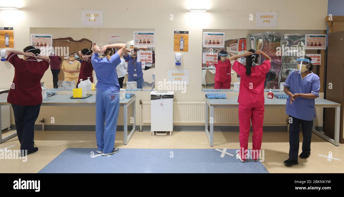 Nurses practice social distancing while donning PPE at Craigavon Area ...