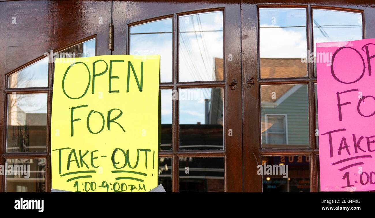 Open for take out only sign posted on the windows of a restaurant in ...