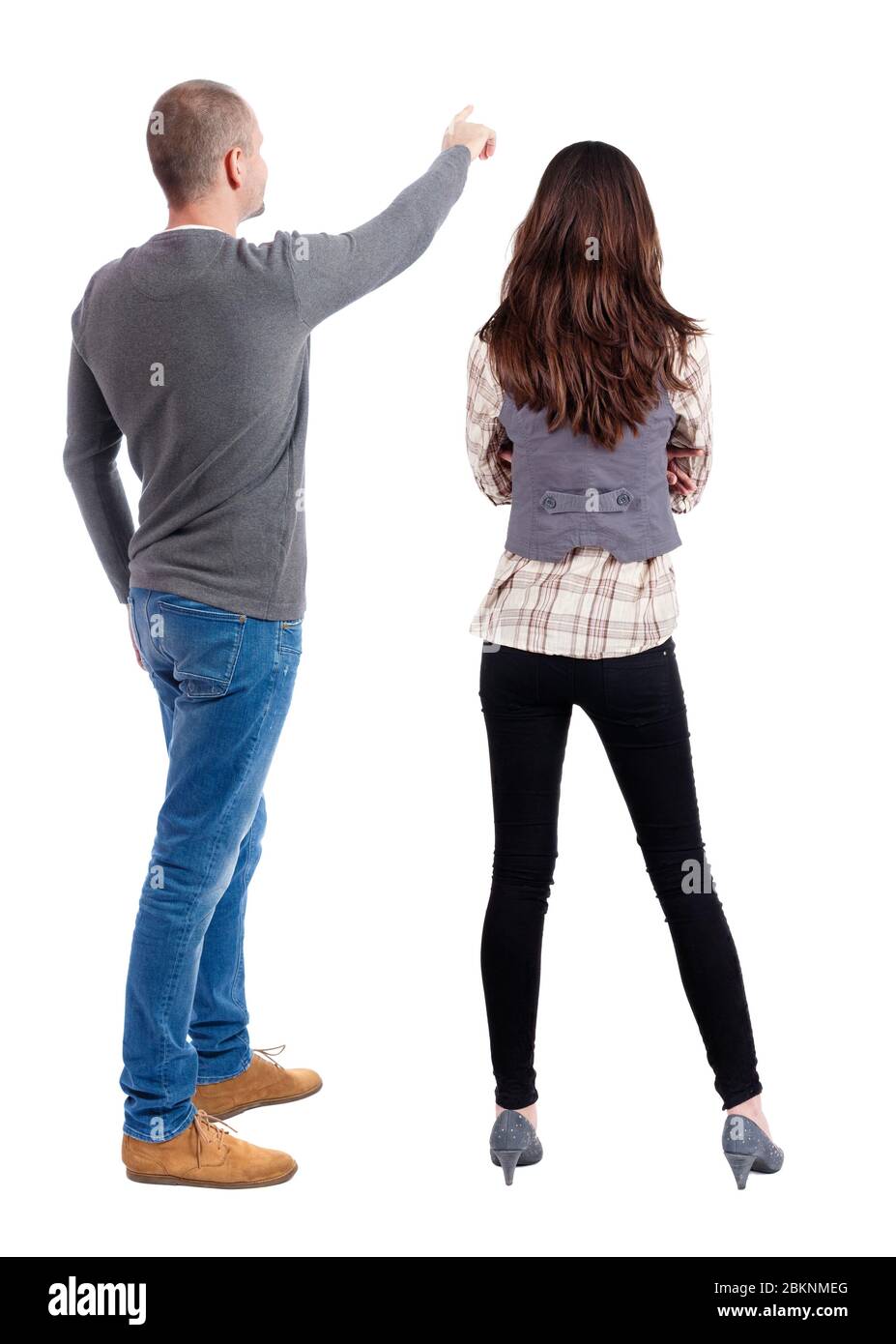 Back view of couple in sweater pointing. Rear view people collection ...