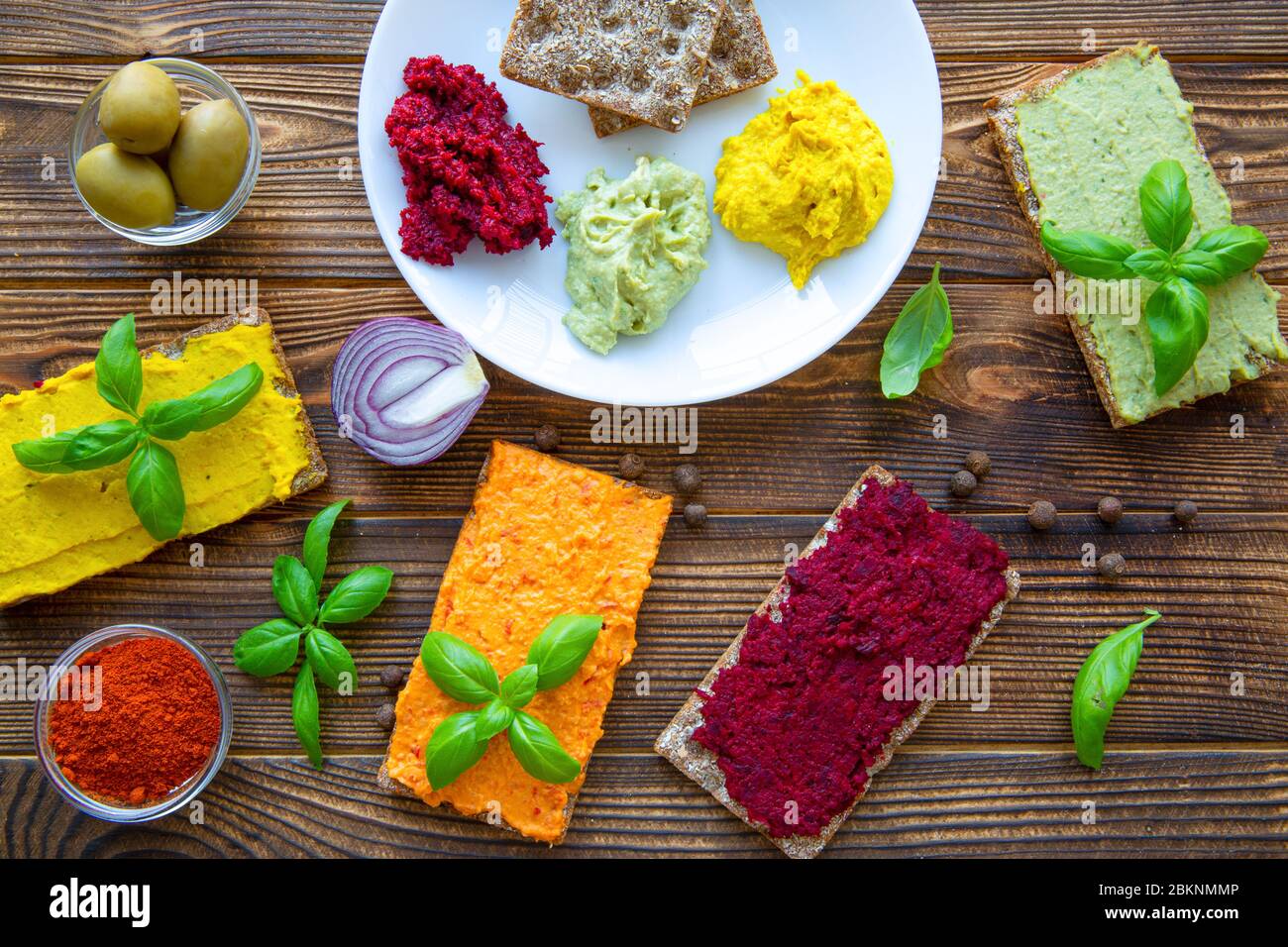 Assortment of hummus appetizer, tasty arabic snack on wooden rustic ...