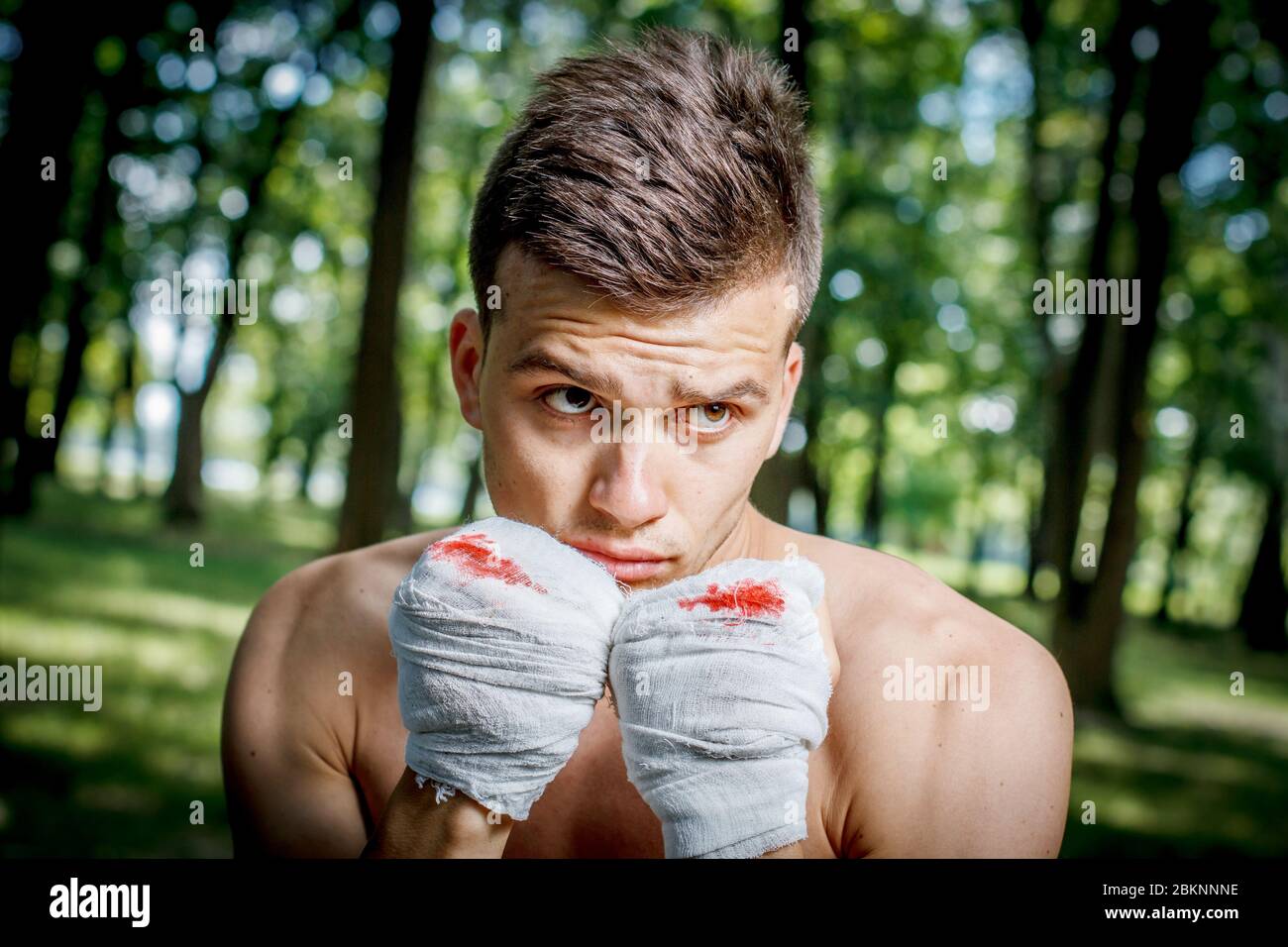 aggressive boxer diligently trains hands in blood Stock Photo - Alamy