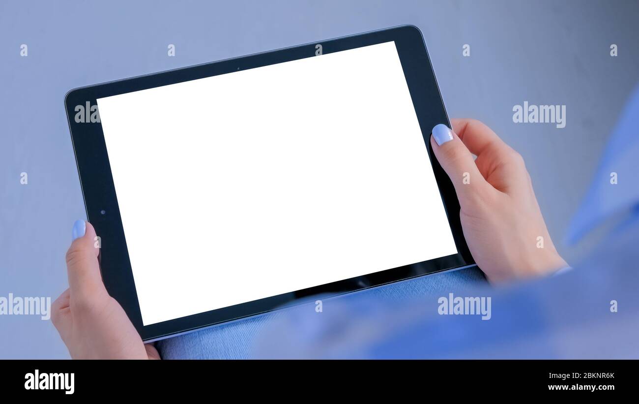 Over shoulder closeup view: woman hands holding digital tablet computer ...