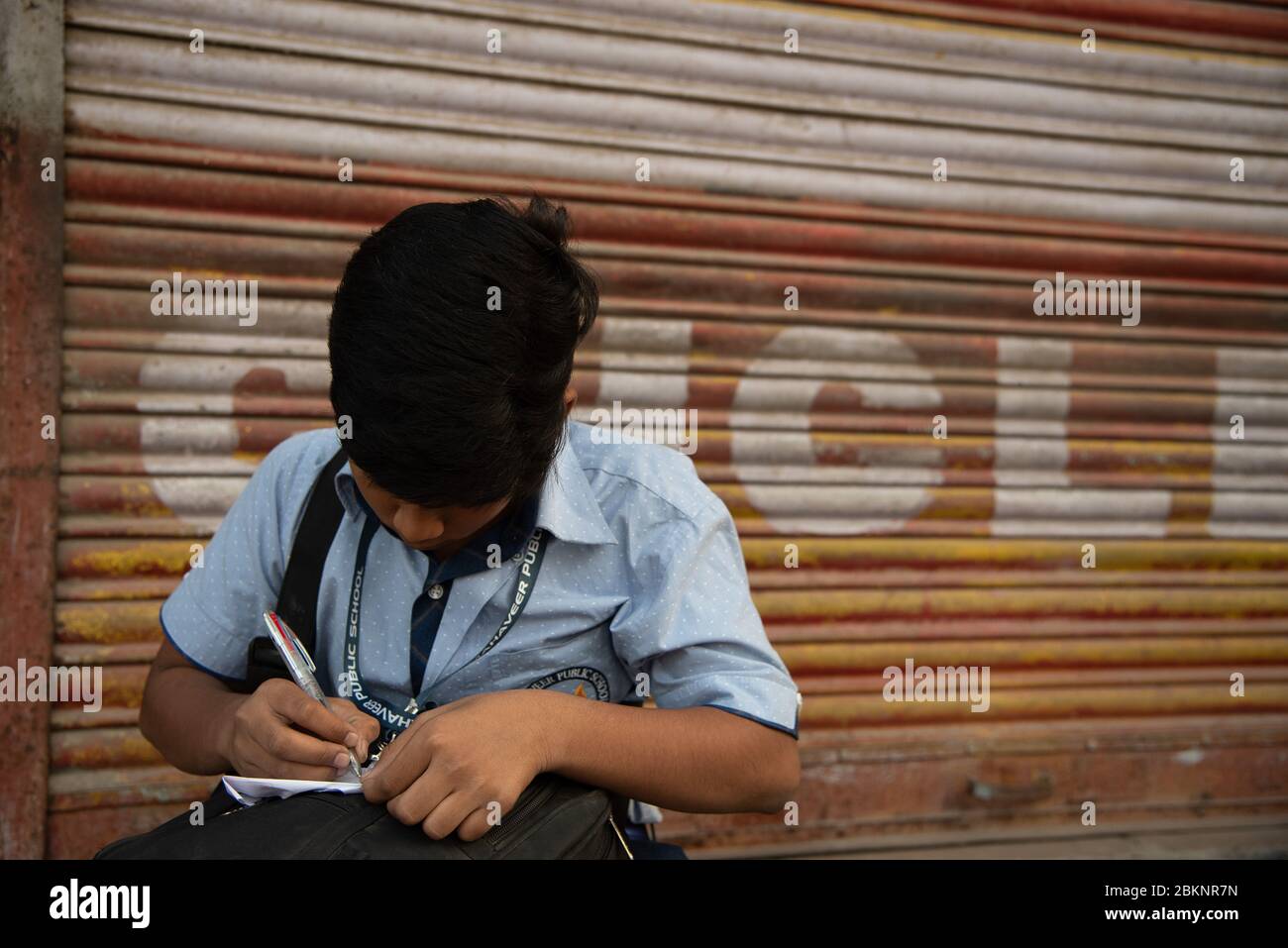 Close-up portrait of Indian boy writing. Jodhpur, Rajasthan, India ...