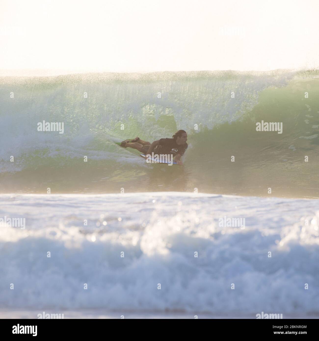 Body surfer riding a perfect wave Stock Photo - Alamy