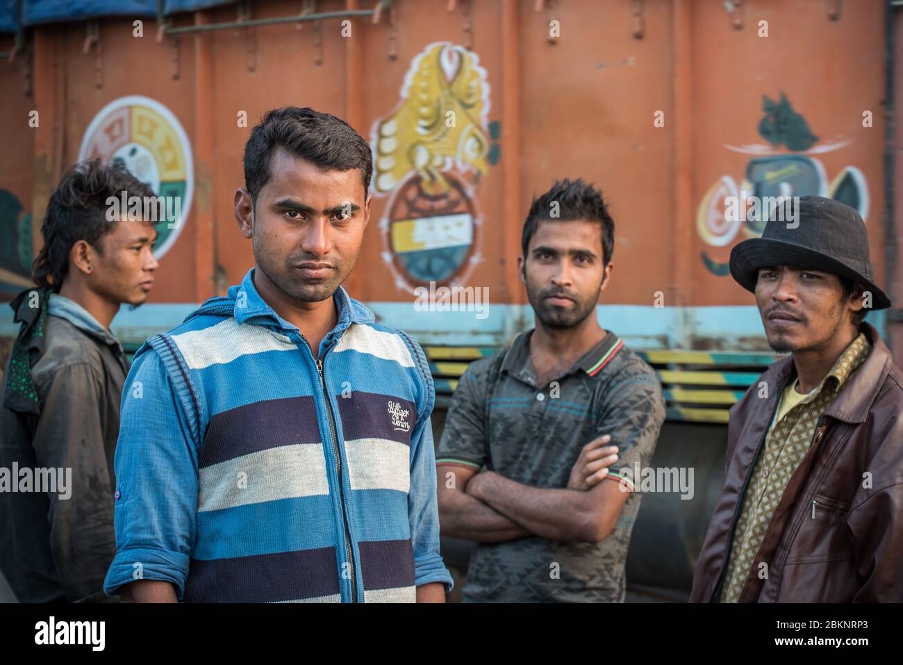 Portrait of four Indian male truck drivers waiting at the Assam ...