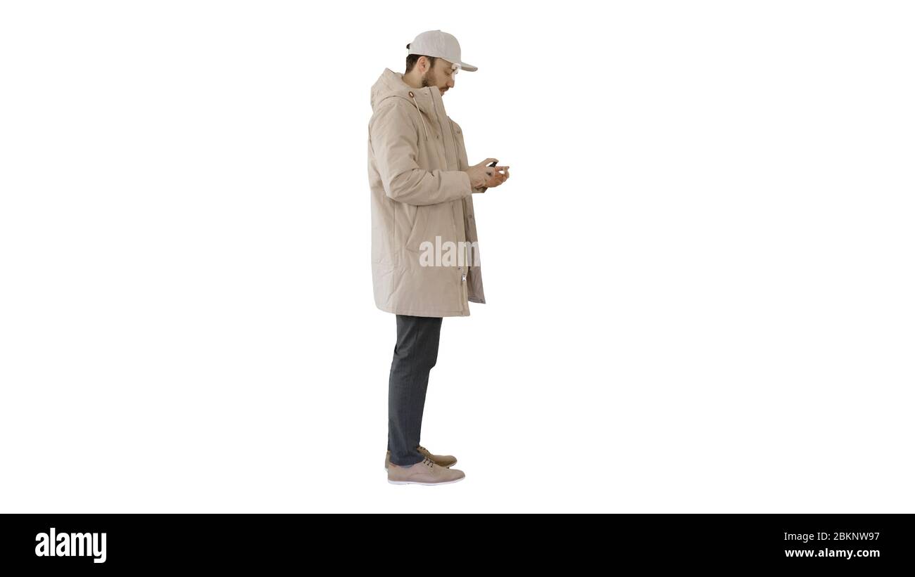Man in winter clothes using sanitizer spray to prevent flu disease on ...