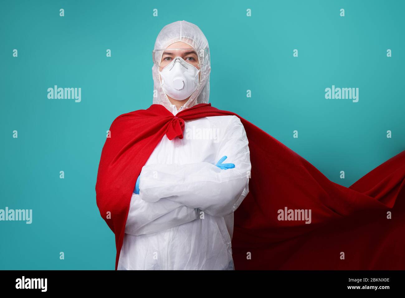 Doctor is wearing PPE - costume, gloves and surgical face mask in ...