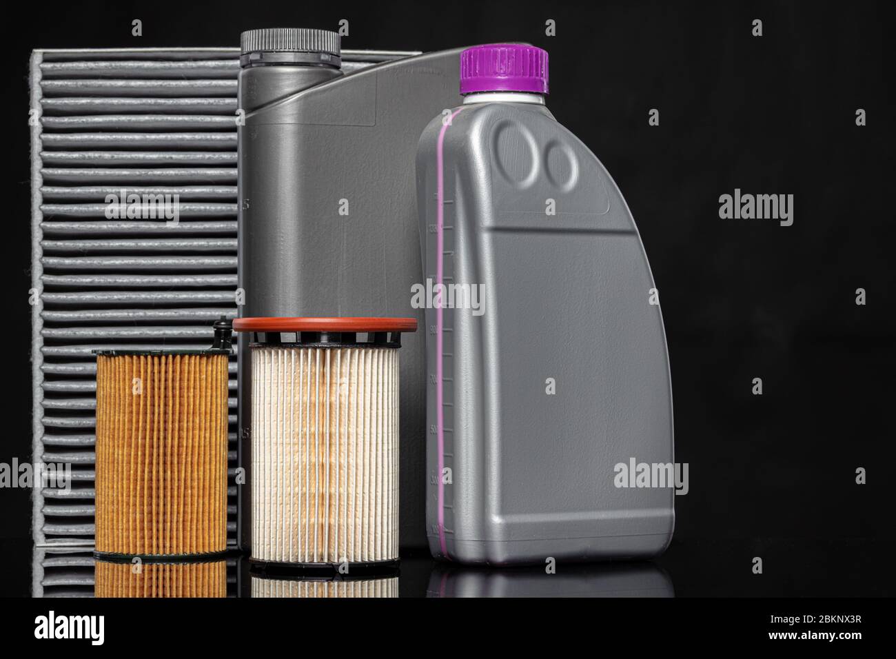 Car oil filters and motor oil can on dark background Stock Photo - Alamy