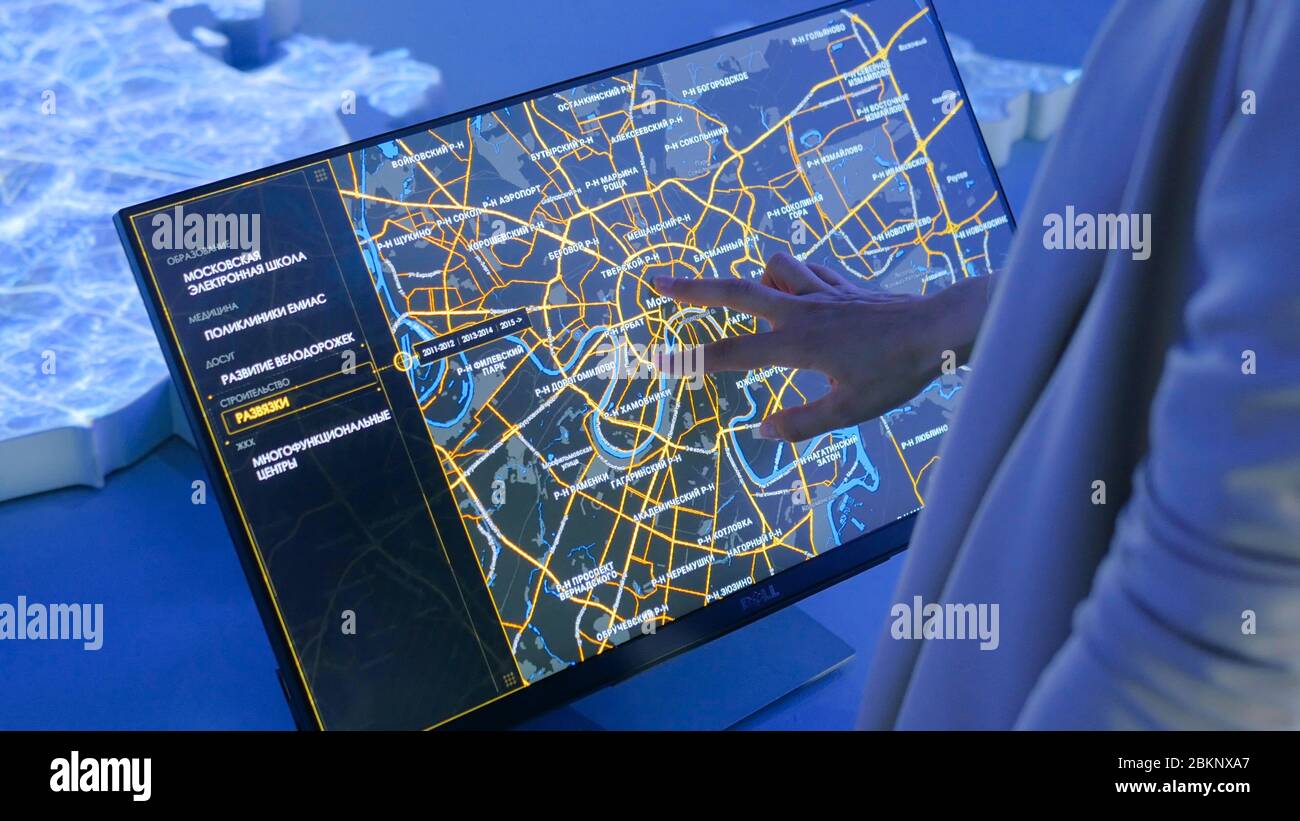 MOSCOW, RUSSIA - July 30, 2018: Smart City Exhibition. Woman using ...