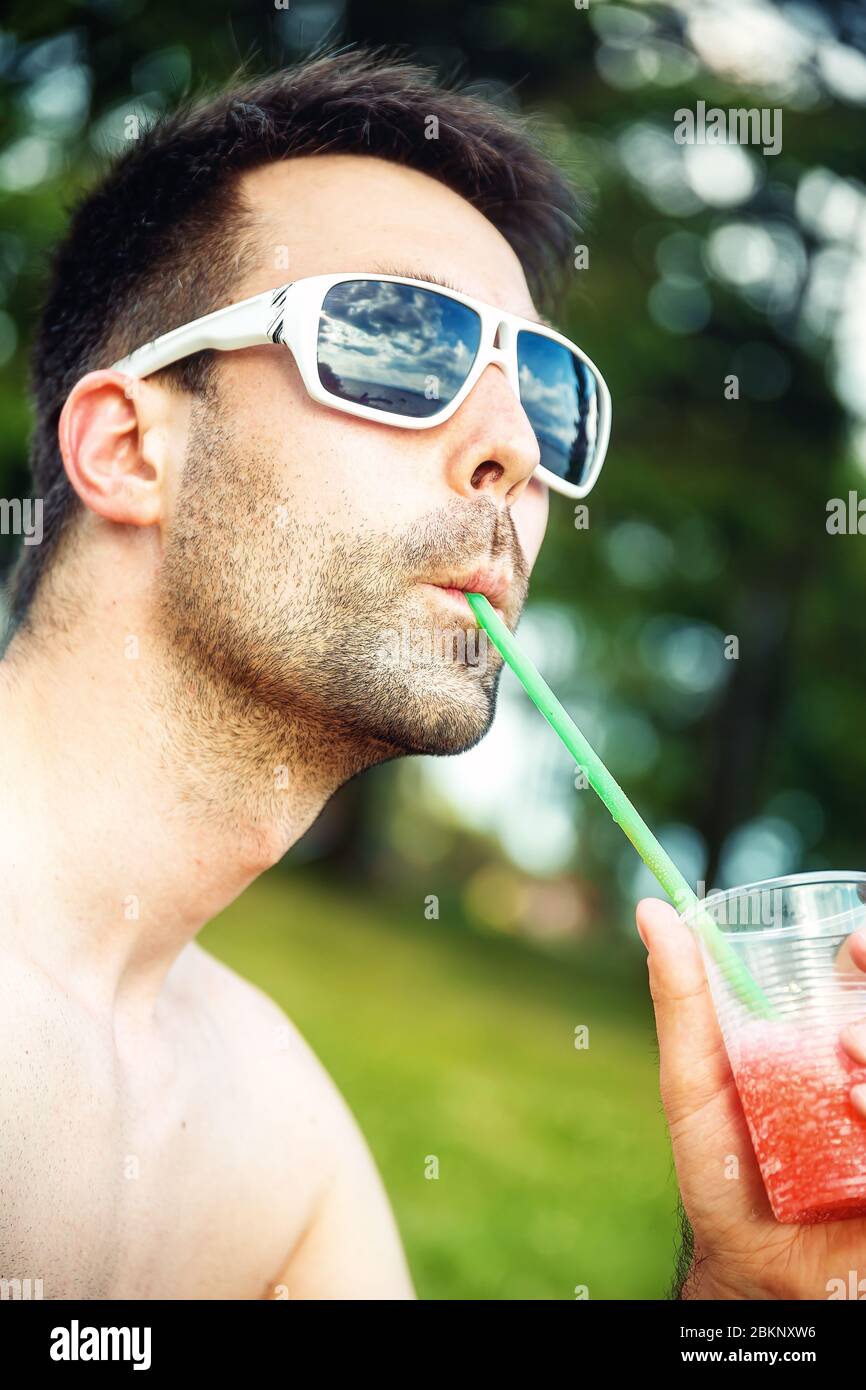man with juice in his hand Stock Photo - Alamy