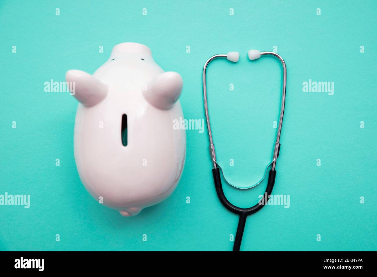 Cost of healthcare. Piggy bank money box with a medical doctors ...