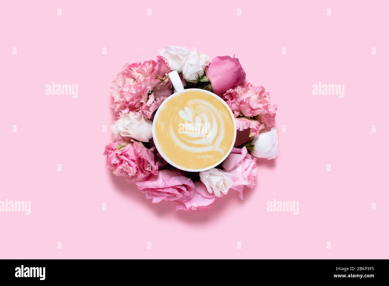 Pink background with a Cup of coffee surrounded by roses Stock Photo ...