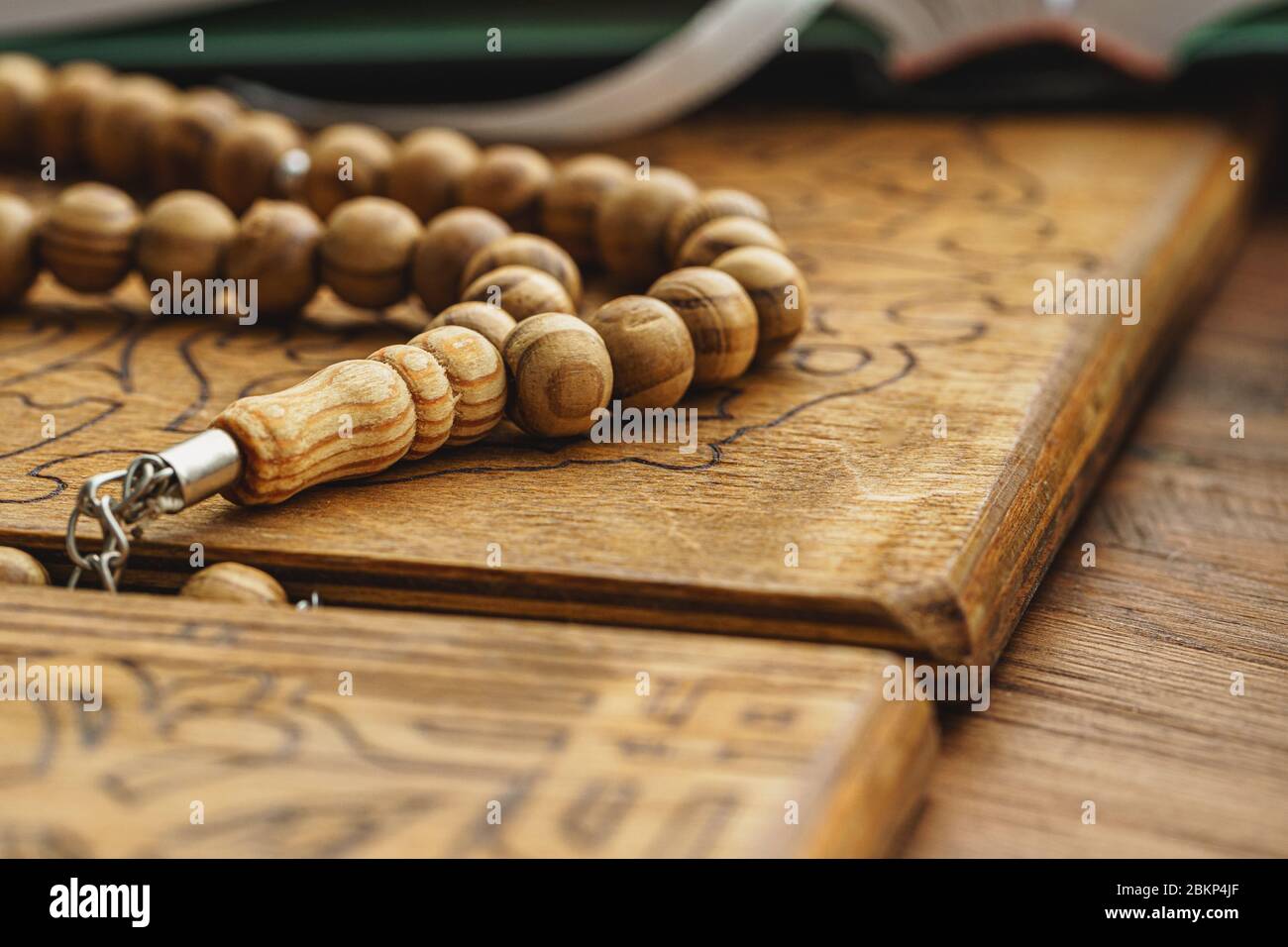 Oriental religious beads close up on a wooden table Stock Photo - Alamy