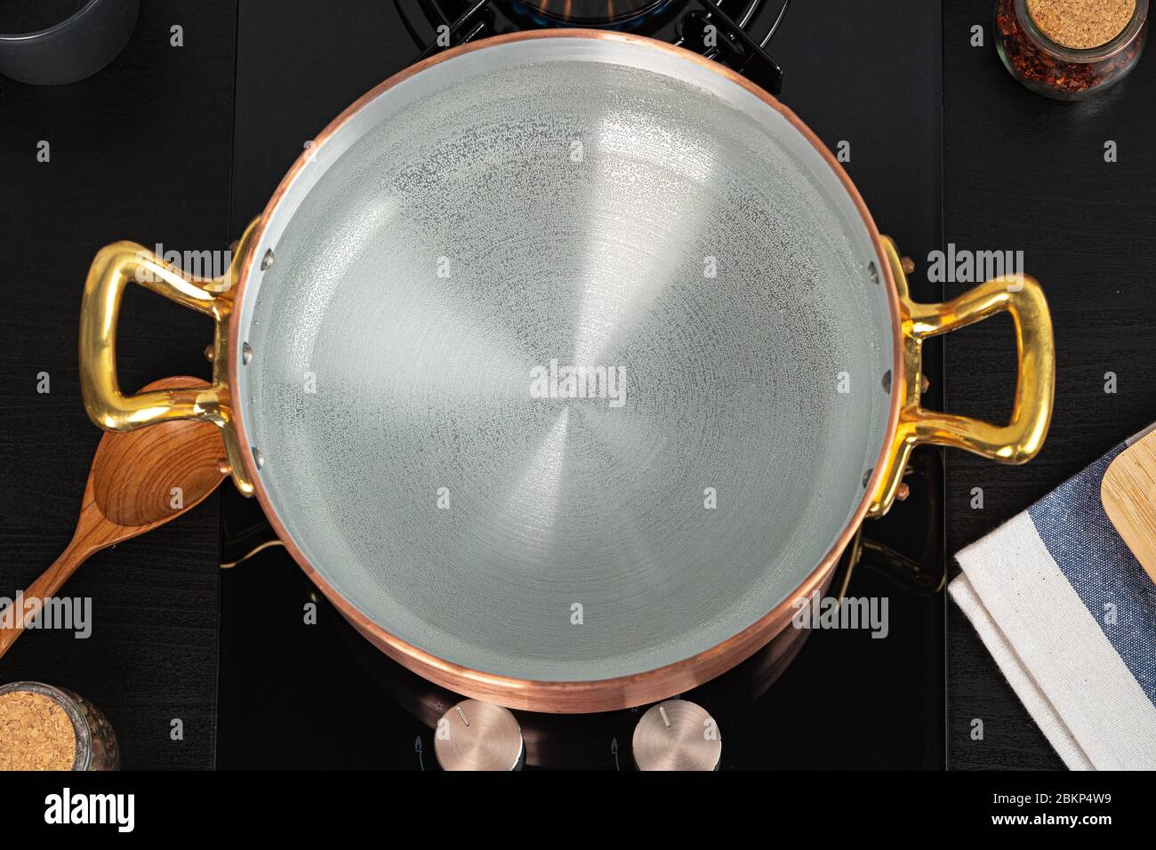 Copper pot with boiling water on a gas stove Stock Photo - Alamy