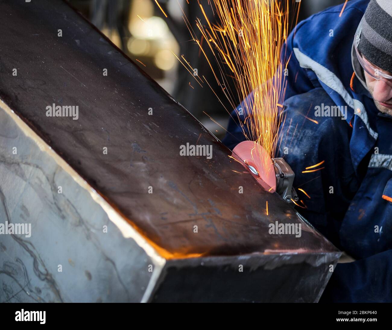 Master grind metal grinder a sparks Stock Photo - Alamy