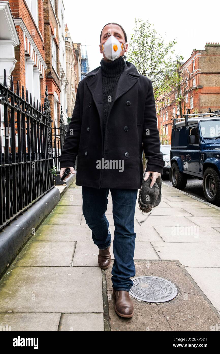 Man walking mask uk hi-res stock photography and images - Alamy