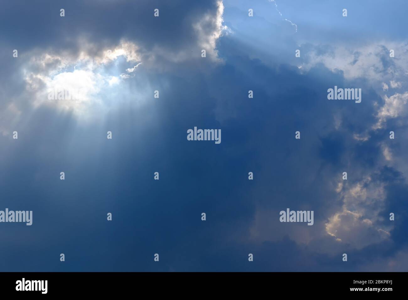 Sunbeam, sunlight through the haze, cloud on the blue sky . Cloud with ...