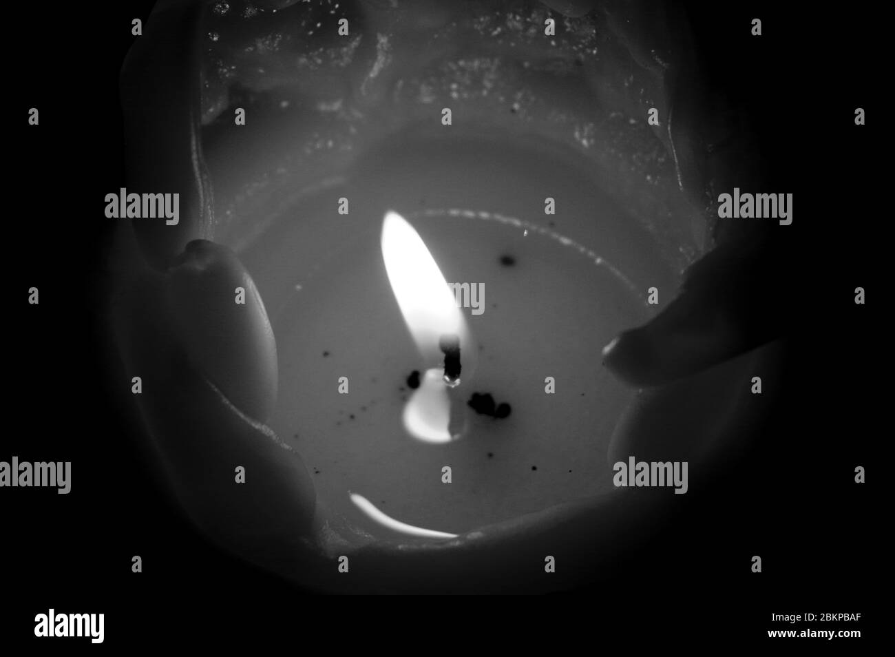 One candle flame at night closeup view hi-res stock photography and ...