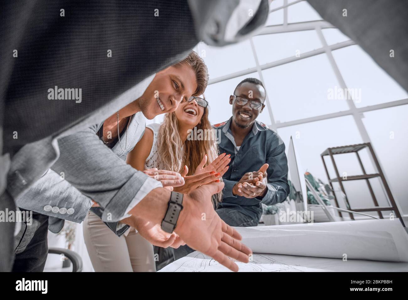 close up.creative group of designers standing near the desktop Stock ...