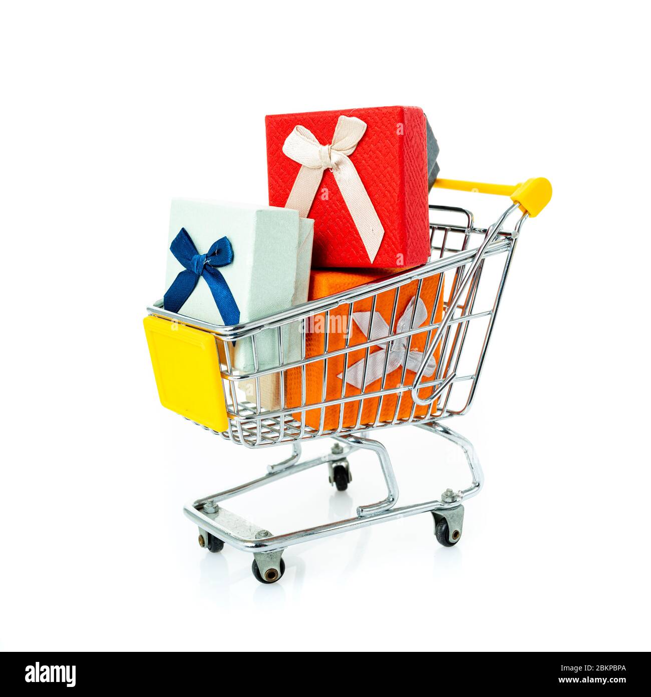 shopping cart with gifts isolated on white Stock Photo - Alamy