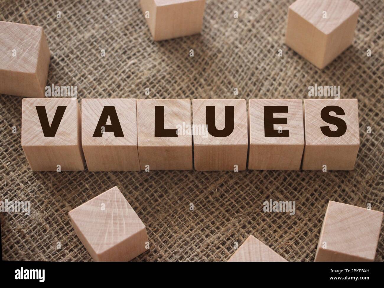 Values Word Written In Wooden Cubes on burlap background. Core values ...
