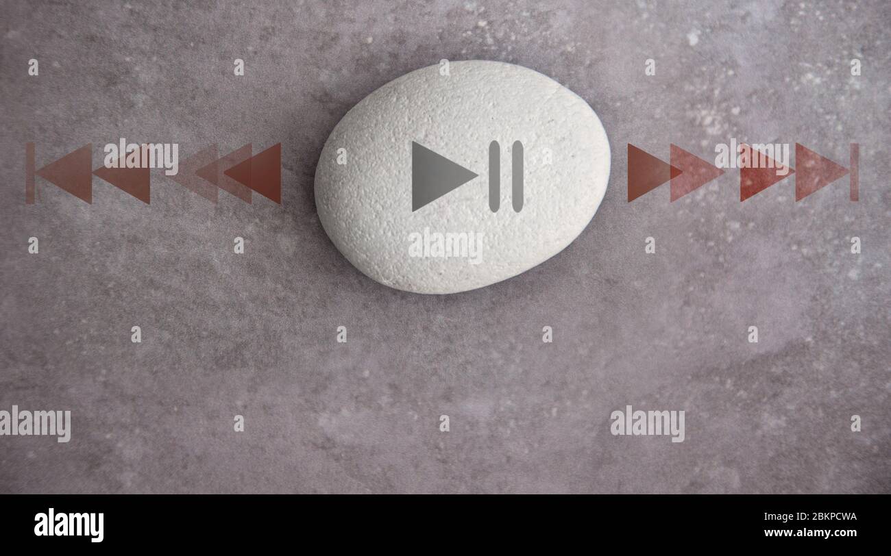 Mindfulness zen stone with pause symbol, and moving fast forward ...