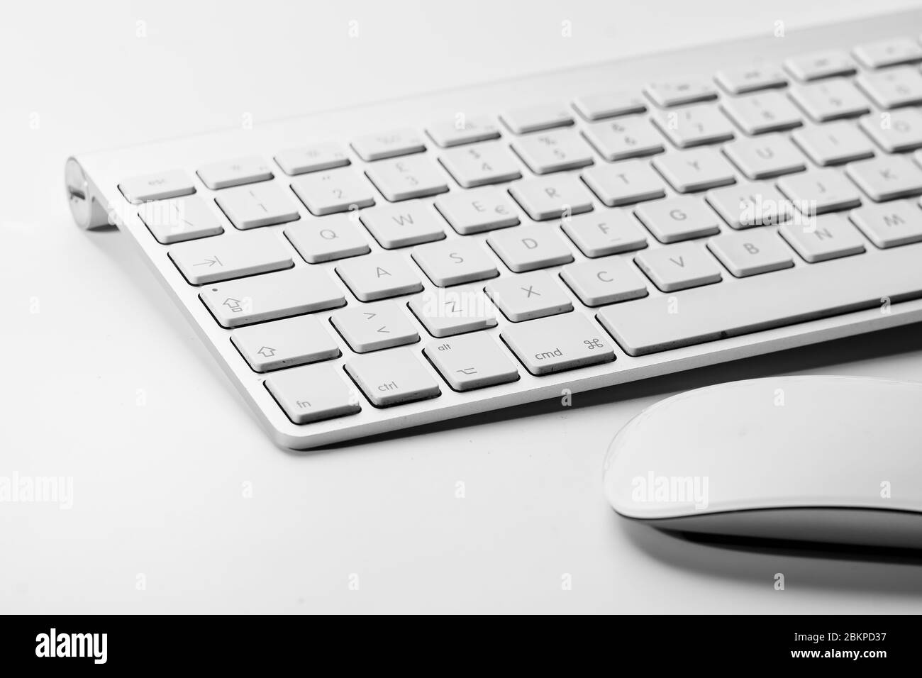 White mouse and keyboard of a personal computer on a white background ...