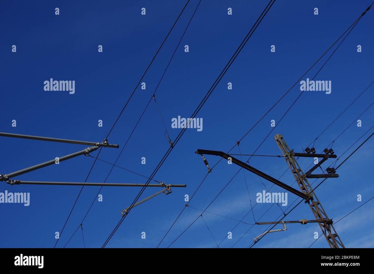Power electricity wire for trains against sky. Close up of railway ...