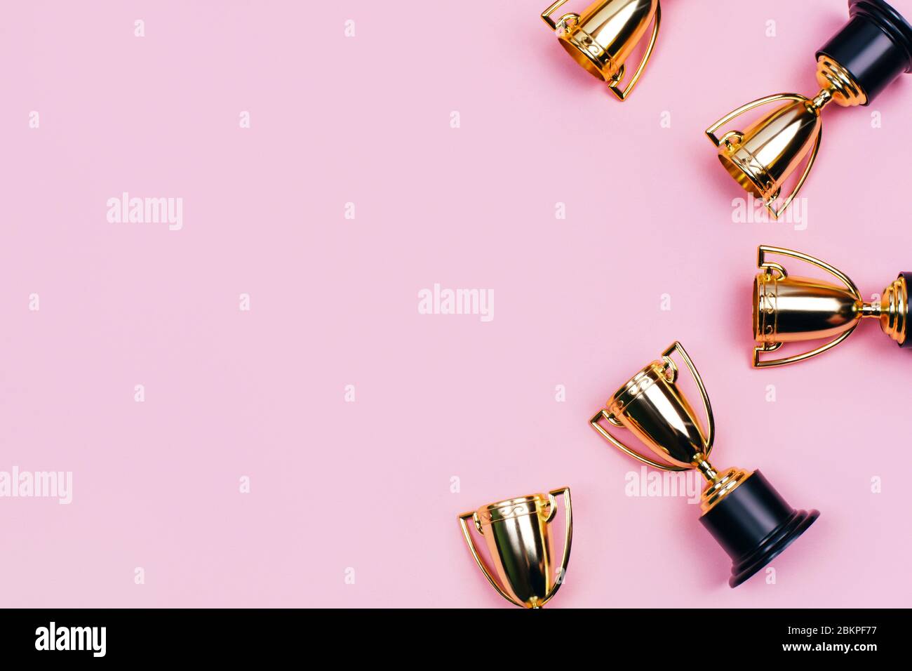 Winner cups on a pink background. Banner with a place for text. Flat ...