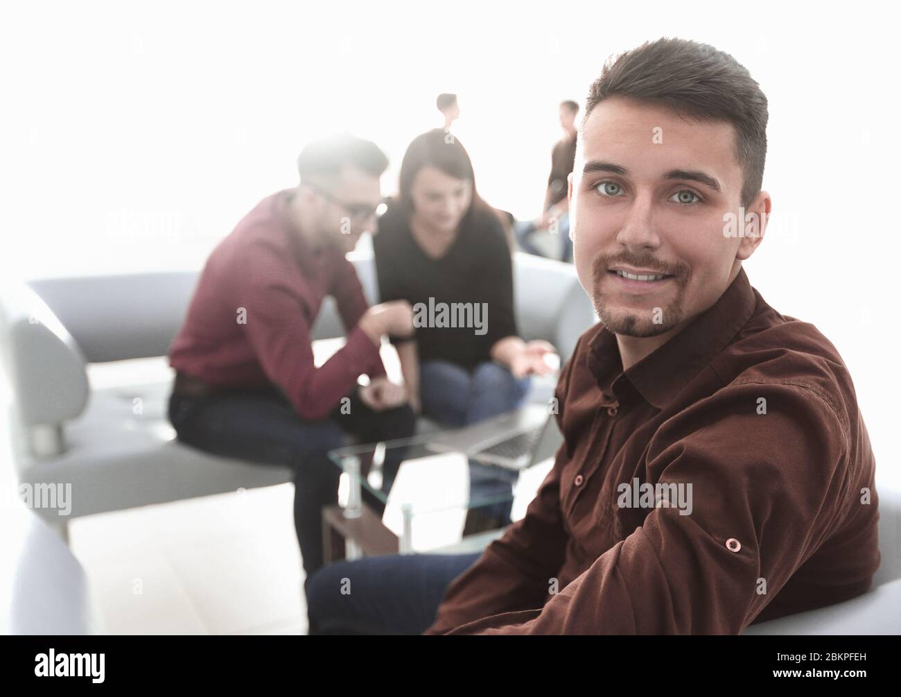 employee on the background of business team Stock Photo - Alamy