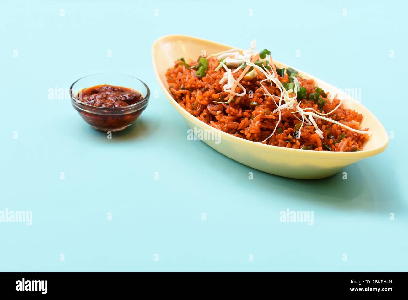 Schezwan fried rice with schezwan sauce, Chinese fried rice,garnished ...