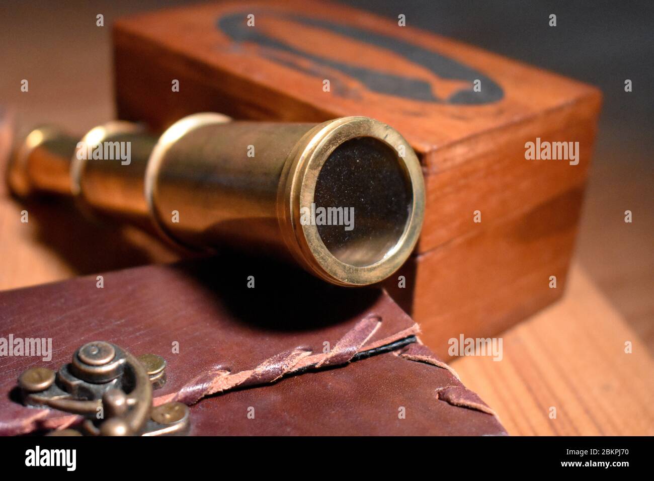 Monocular with ship and pirate stuff Stock Photo - Alamy