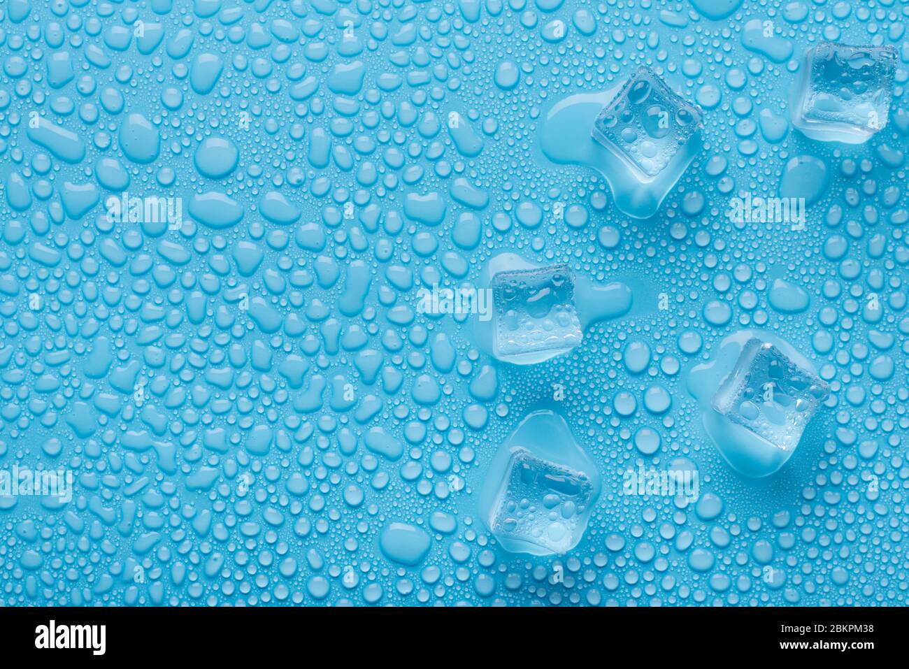 Top above overhead close up macro view photo of ice cubes and water ...