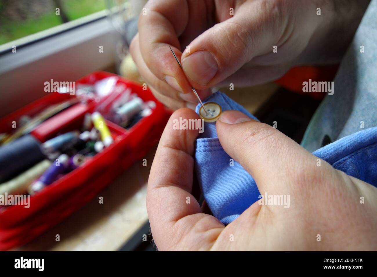 Sewing needle in fabric hi-res stock photography and images - Alamy