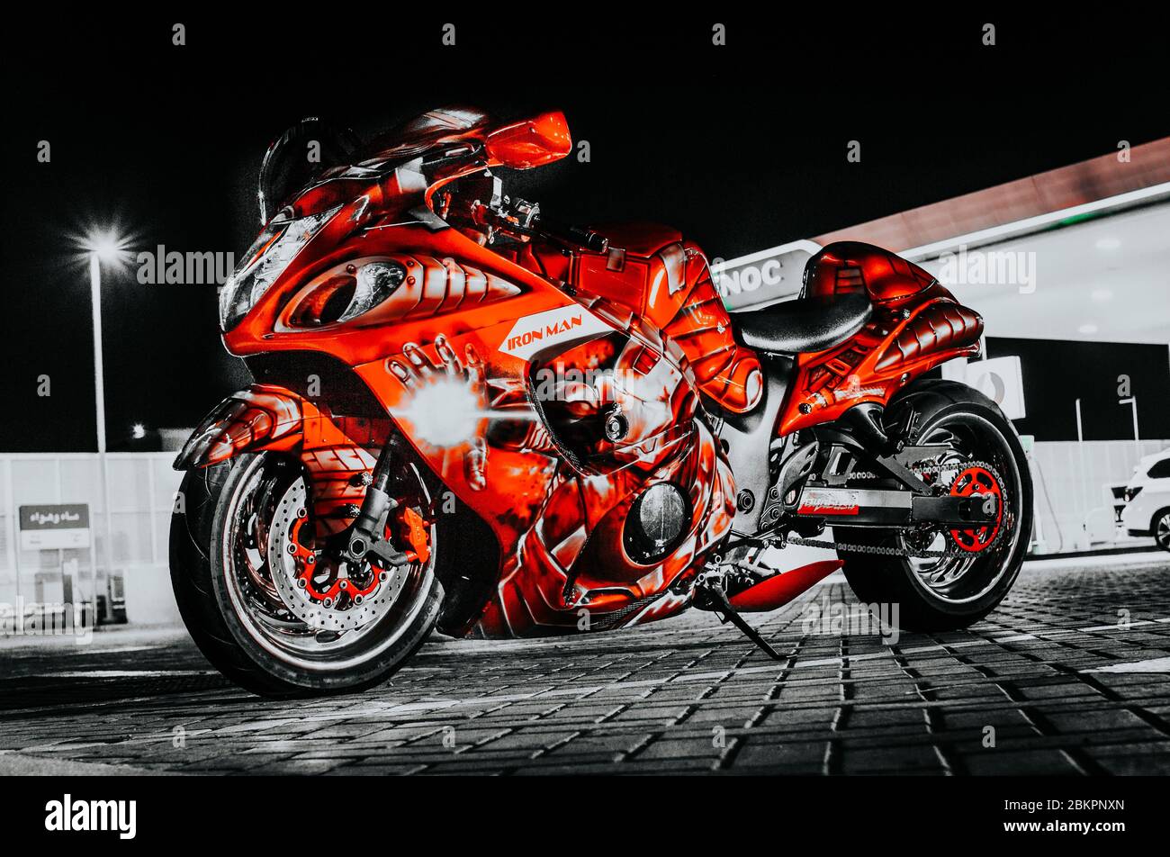 Back view of the red sport motorcycle standing alone on the parking ...