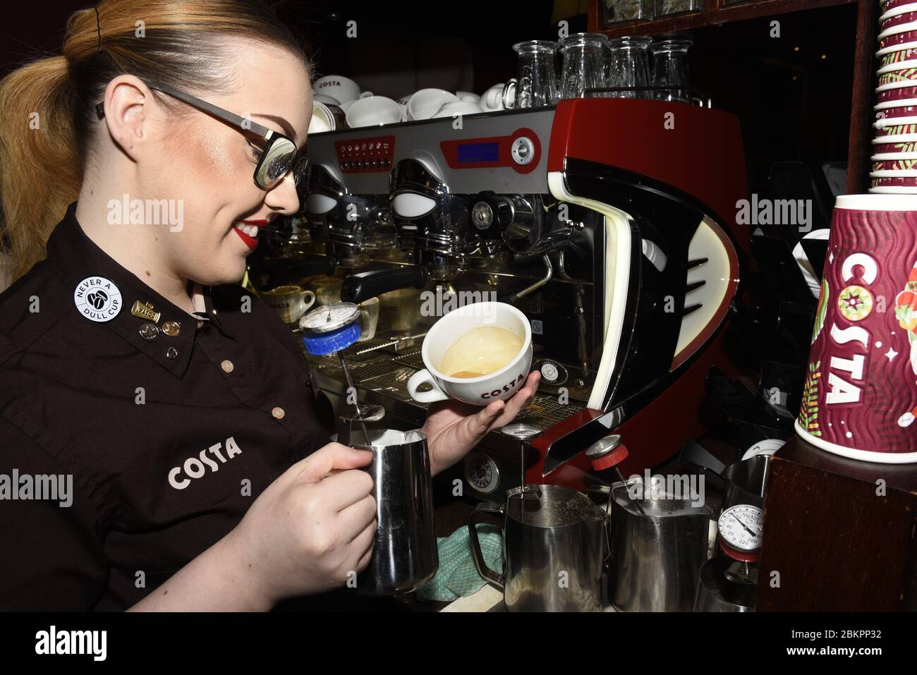 Costa coffee shop worker in store - a barista making coffee Stock Photo ...