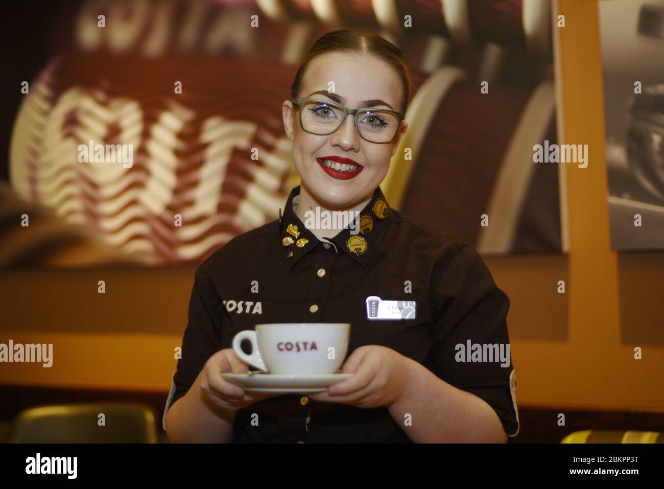 Costa coffee shop worker in store - a barista making coffee Stock Photo ...