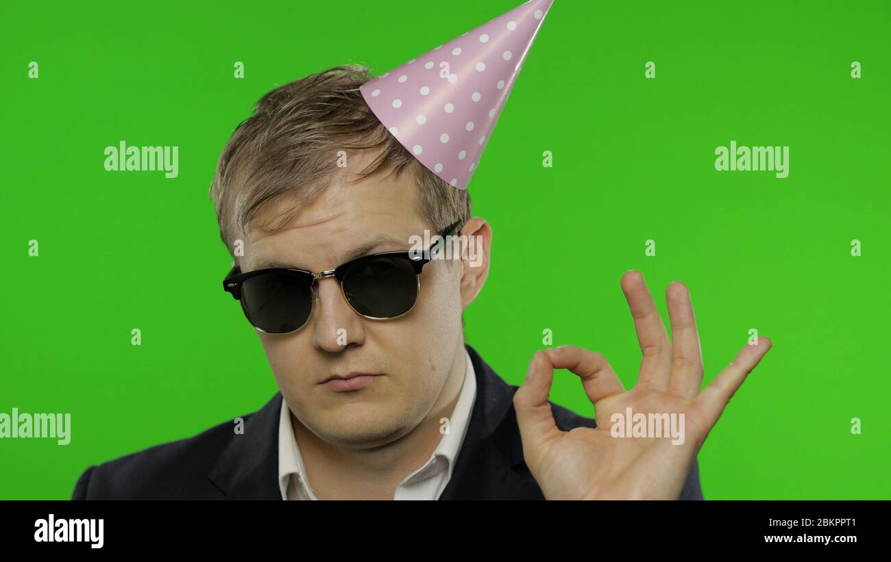 Portrait of drunk sleepy young clerk man with a hangover in sunglasses ...