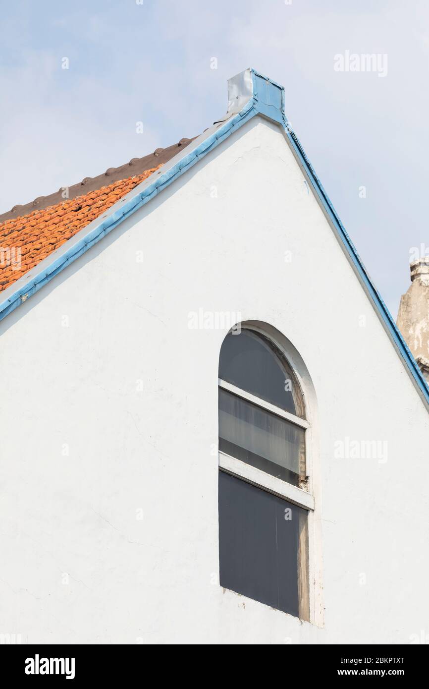 An isolated window on the facade of an old colonial building, in the ...