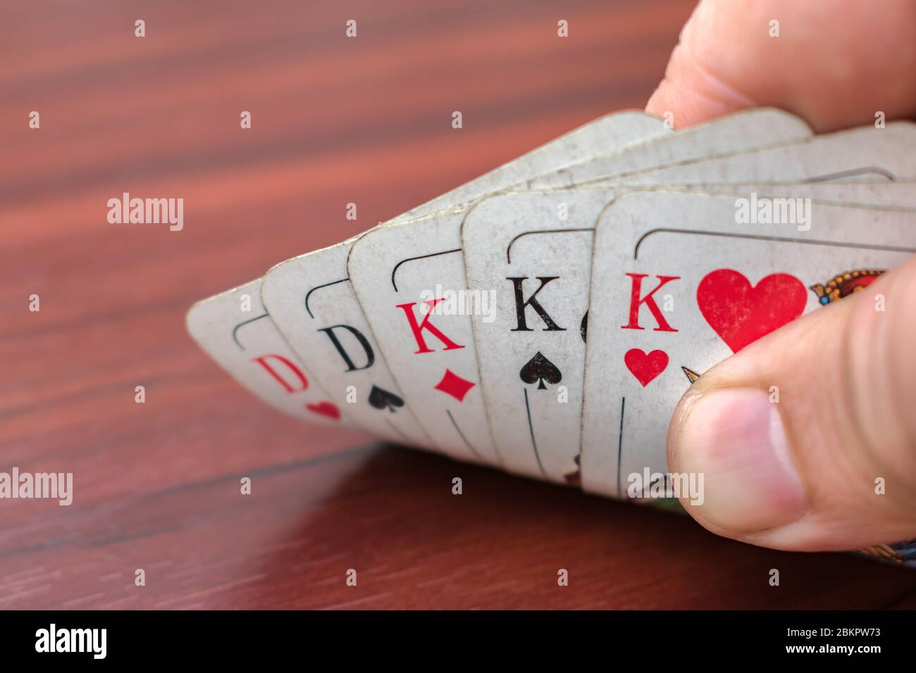 A game of poker and a winning combination full house. Old playing cards ...