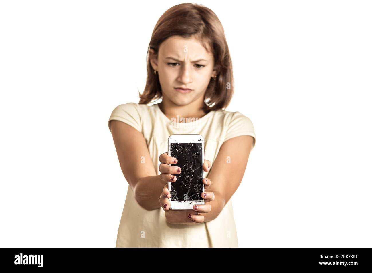 angry little girl holding an phone with broken screen in sudio Stock ...