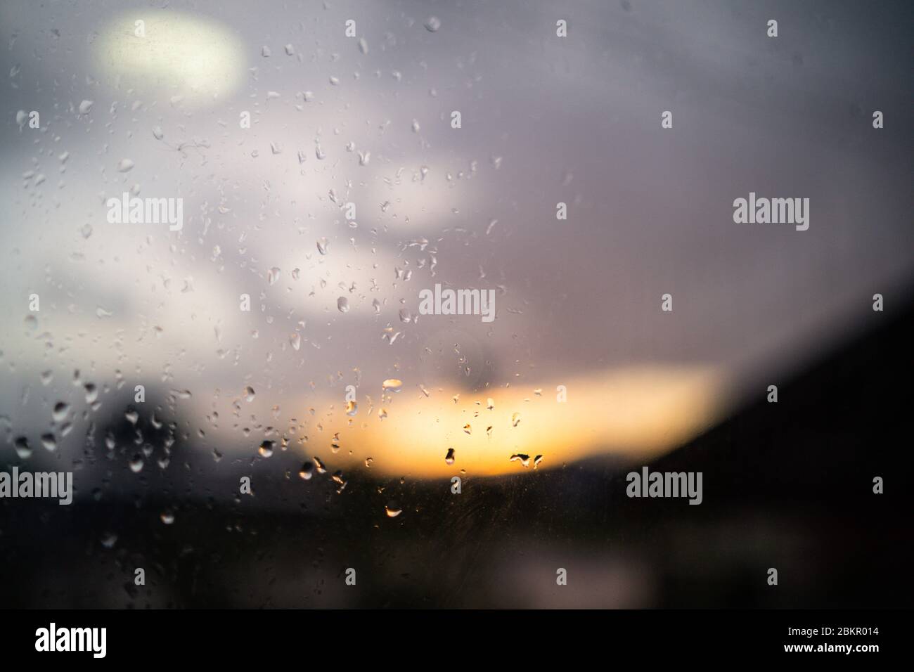 Rain drops on the window beautiful light at sunset with right space ...