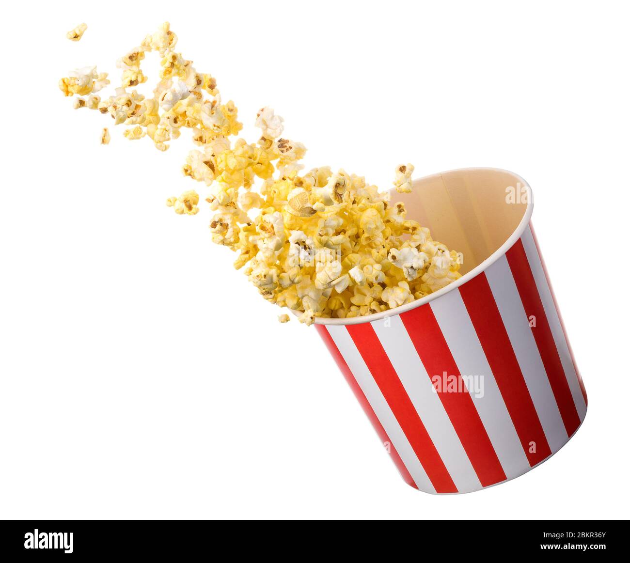 Flying popcorn from paper striped bucket isolated on black background ...