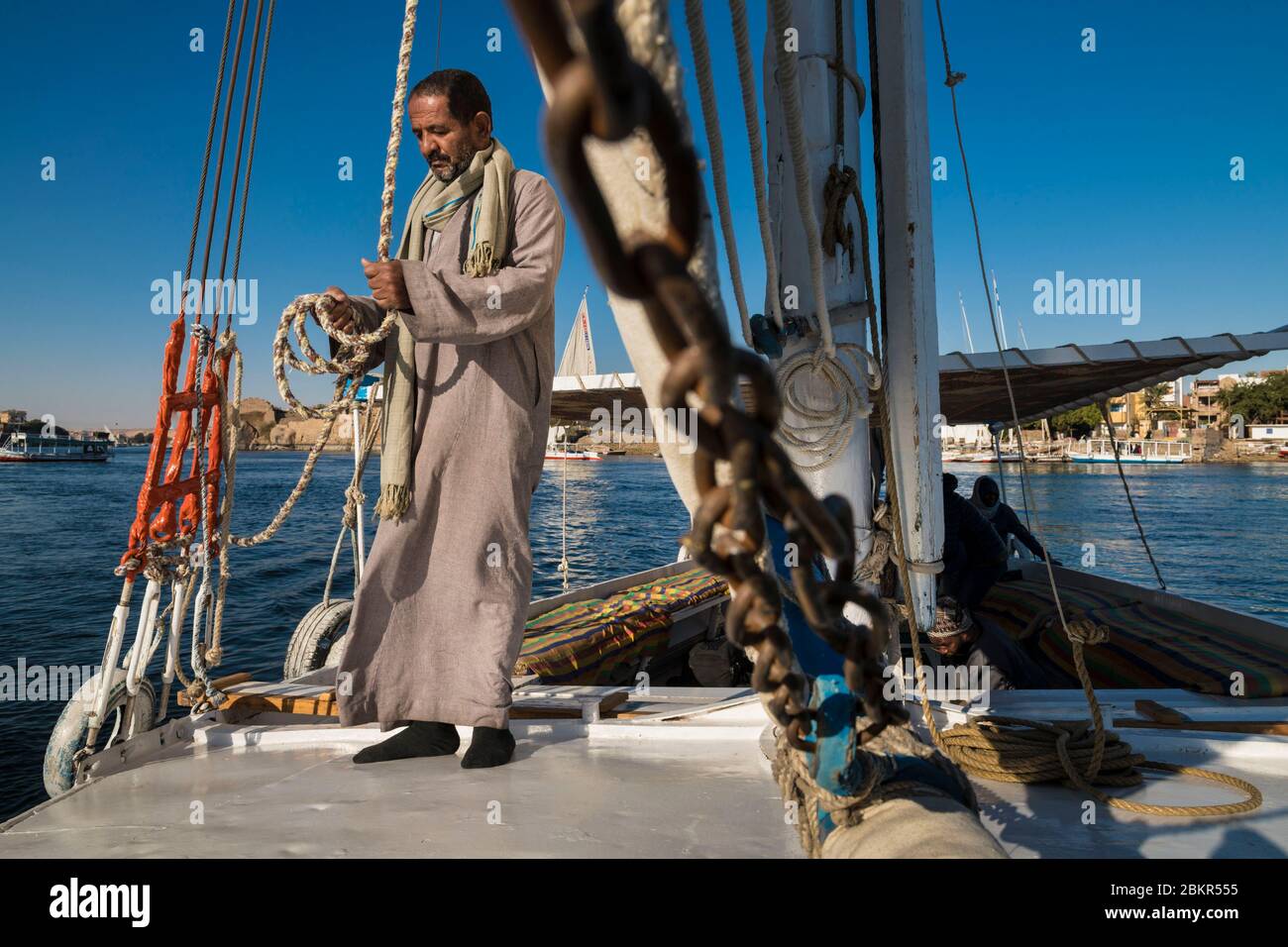 Egypt, Upper Egypt, near Elephanine island, sailor on a felucca sailing ...