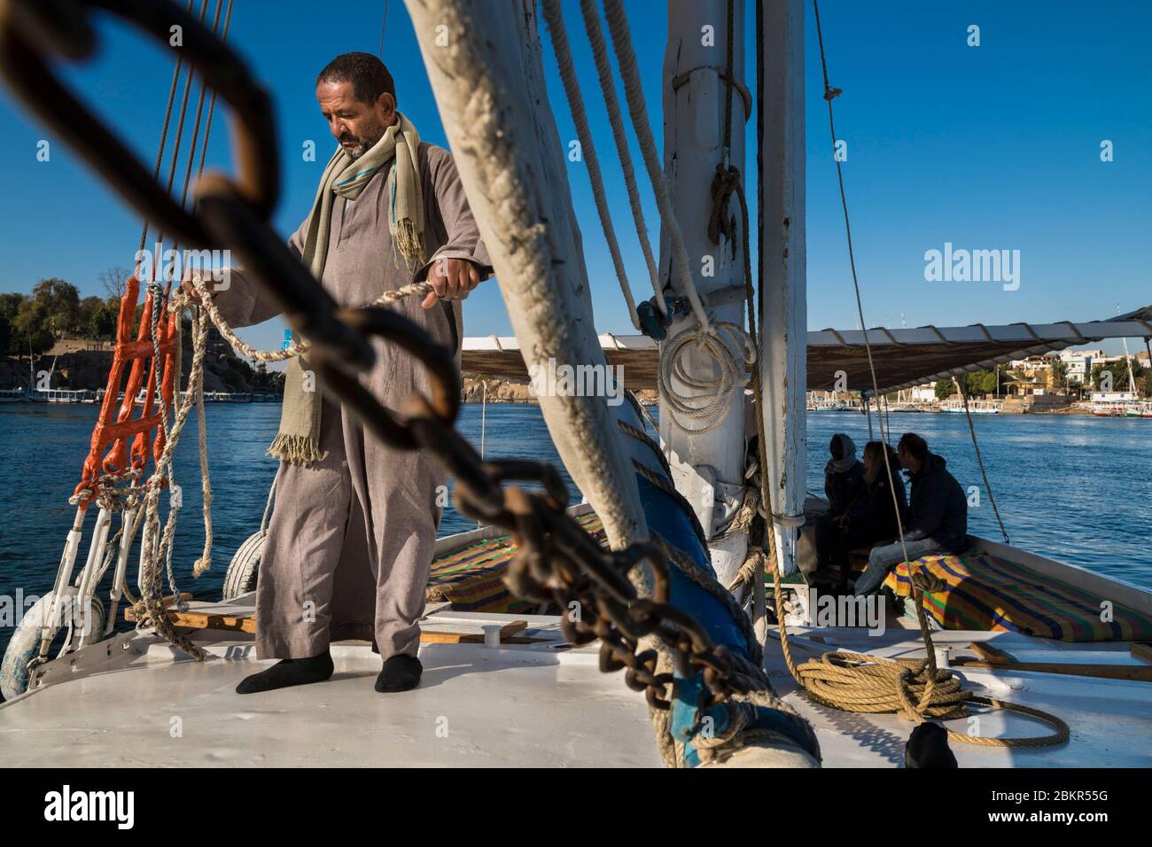 Egypt, Upper Egypt, near Elephanine island, sailor on a felucca sailing ...