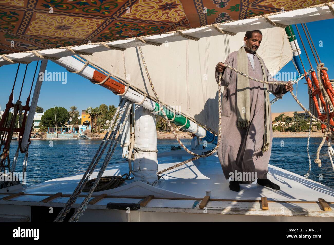 Egypt, Upper Egypt, near Elephanine island, sailor on a felucca sailing ...