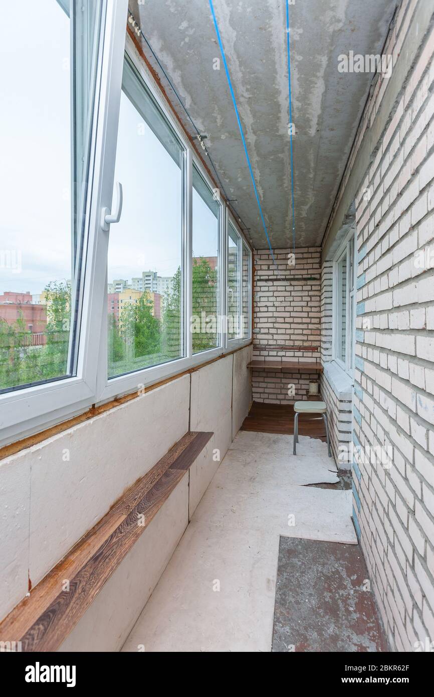 Small old common open balcony interior in high residential apartment ...