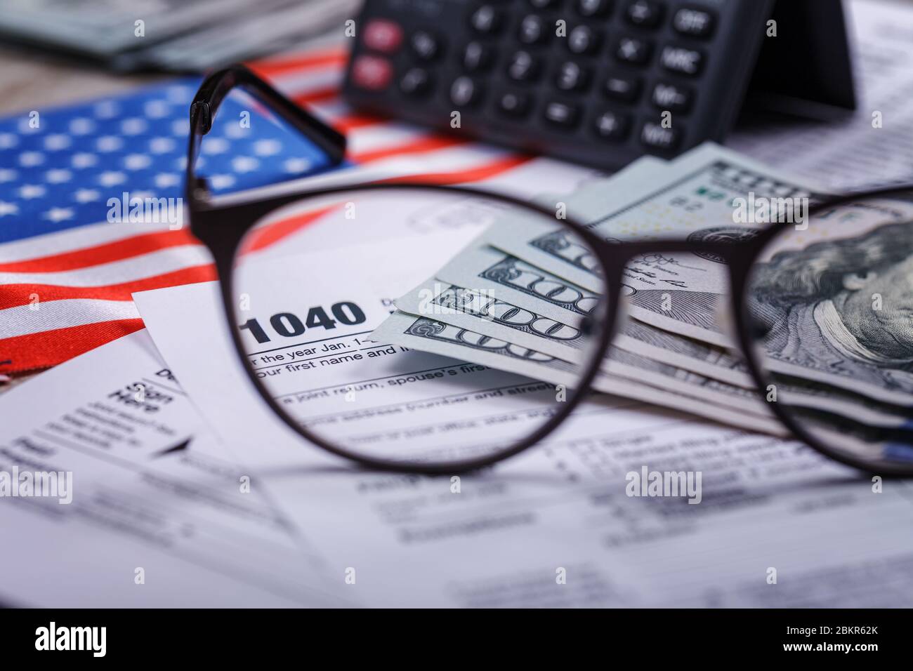 2020 tax return form 1040 with calculator and focus through glasses ...